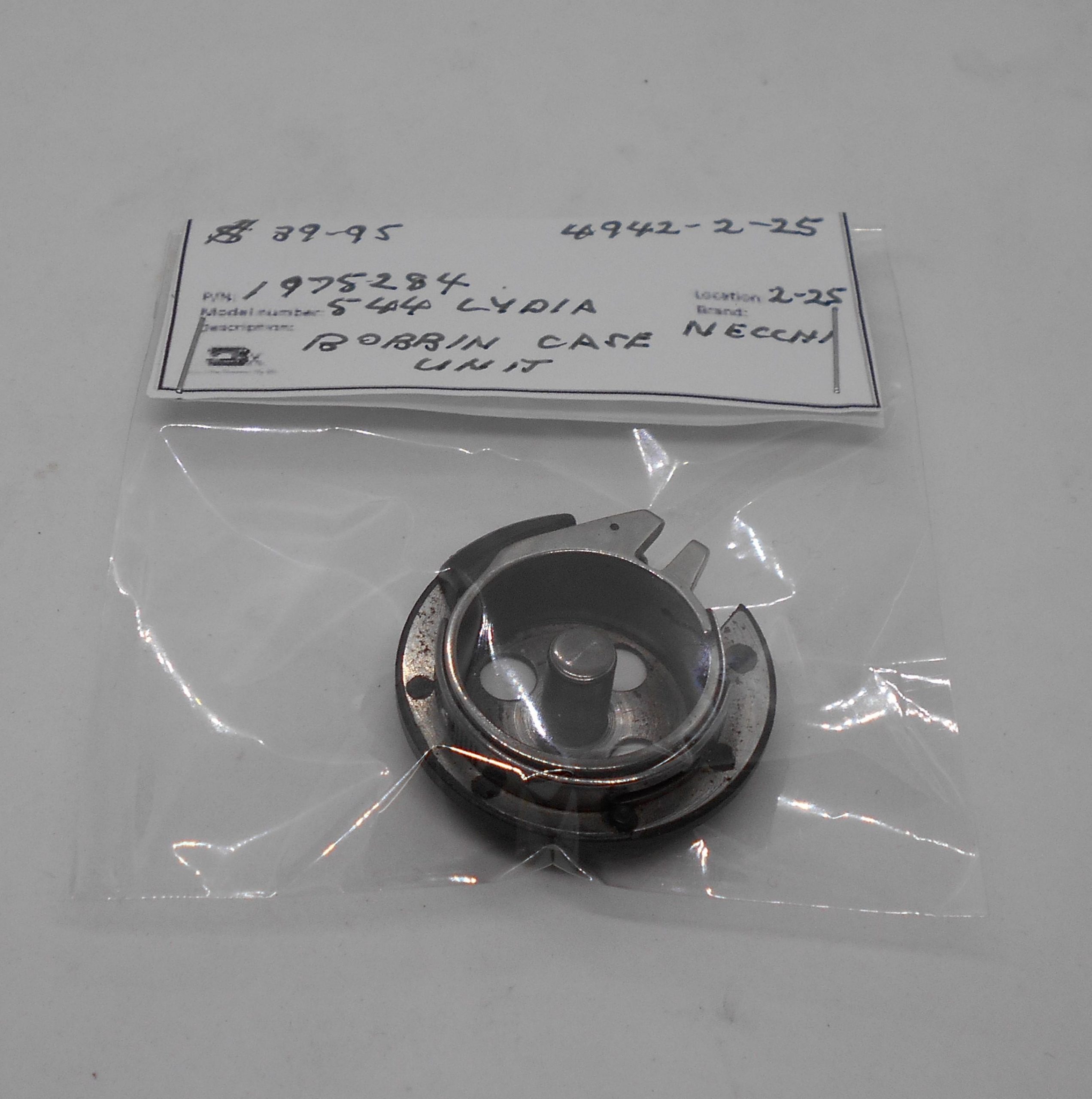 1975284 Bobbin case. Neechi 544 sewing machine. – Maxisew Data EZI